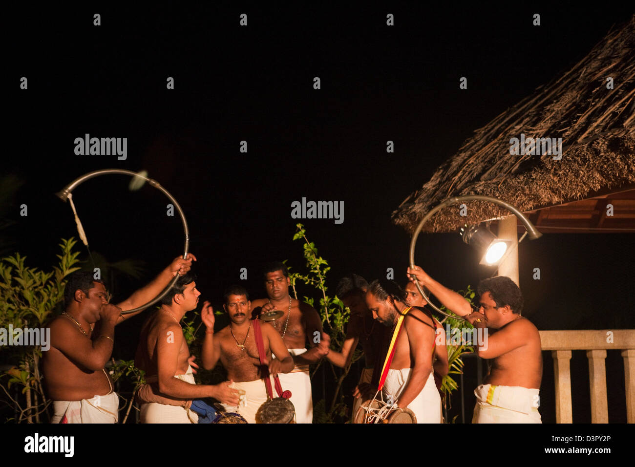 Group of people playing musical instrument during traditional festival ...