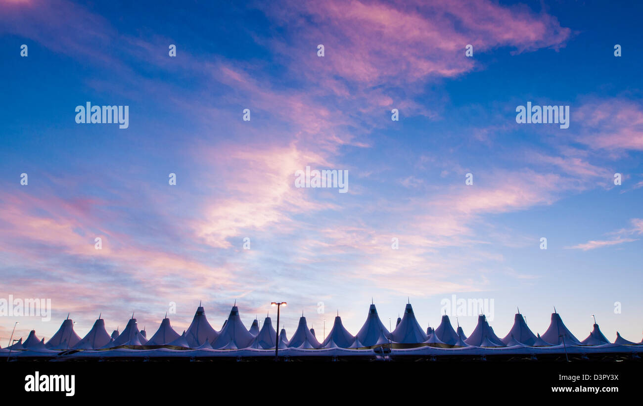 Glowing tents of DIA at sunrise. Denver International Airport well ...