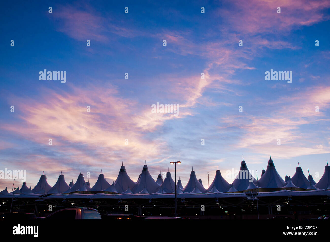 Glowing tents of DIA at sunrise. Denver International Airport well ...