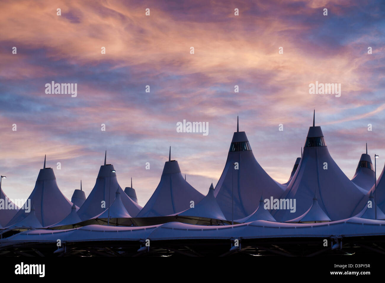 Glowing tents of DIA at sunrise. Denver International Airport well ...