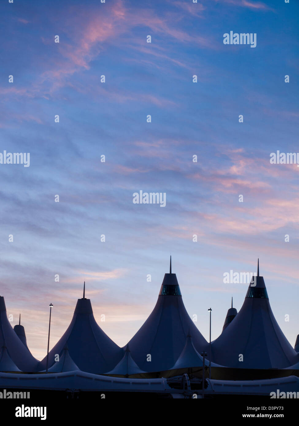 Glowing tents of DIA at sunrise. Denver International Airport well ...