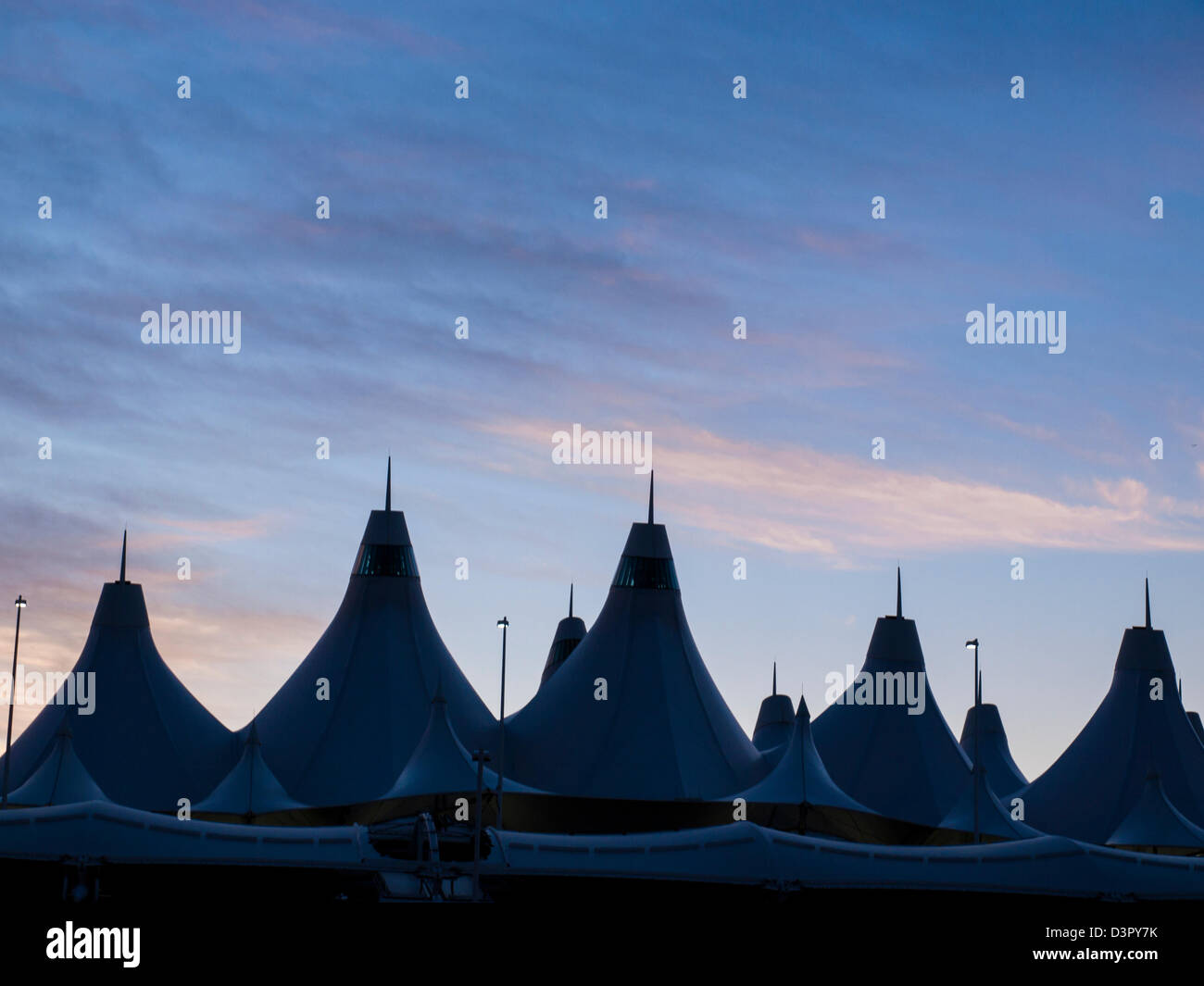 Glowing tents of DIA at sunrise. Denver International Airport well ...