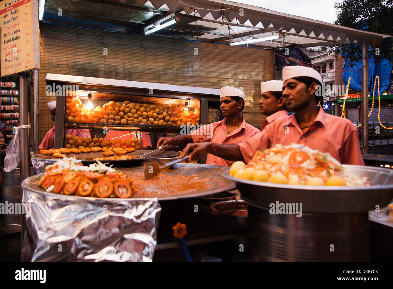 Chefs preparing Indian snacks at a food stall, Chandni Chowk, Old Delhi ...