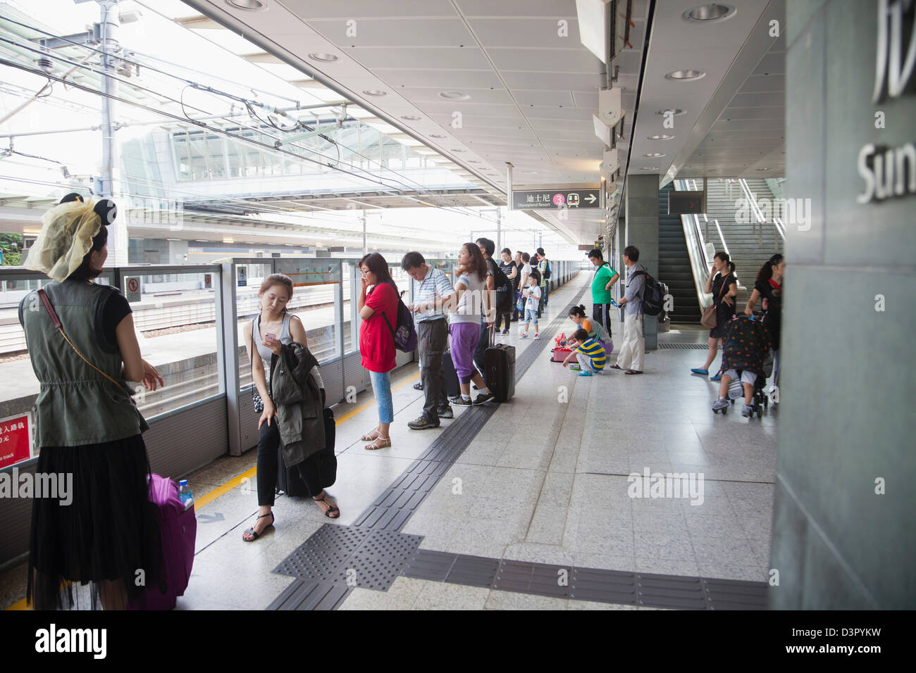 People waiting for train at railroad station, Hong Kong, China Stock ...