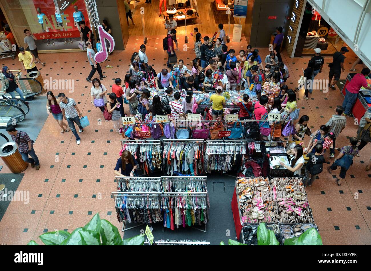 Clothing stalls, shoes and bags on display at shopping mall Stock Photo ...
