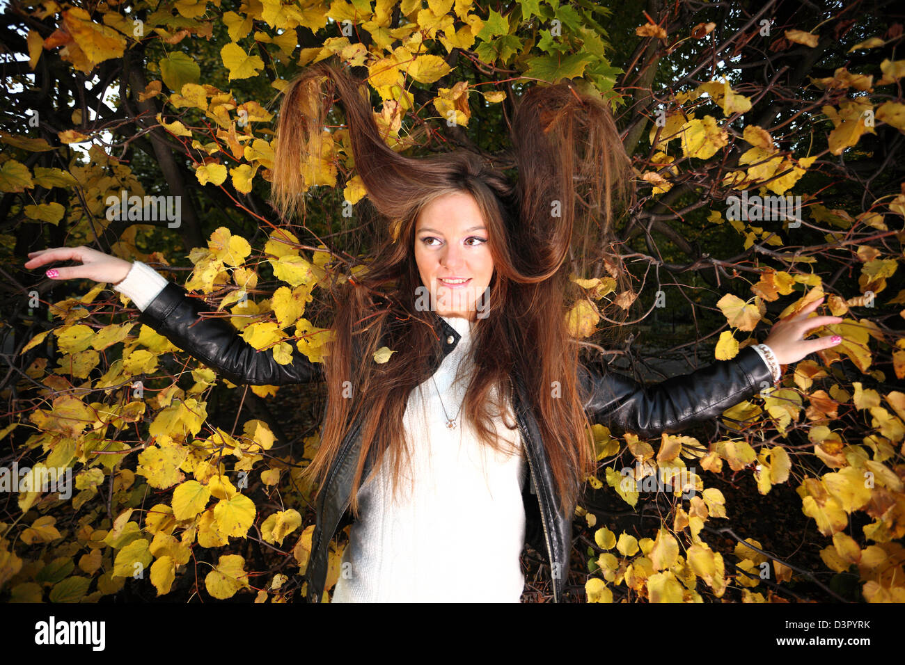 Young woman stand autumn leaves fall yellow green girl garden ...