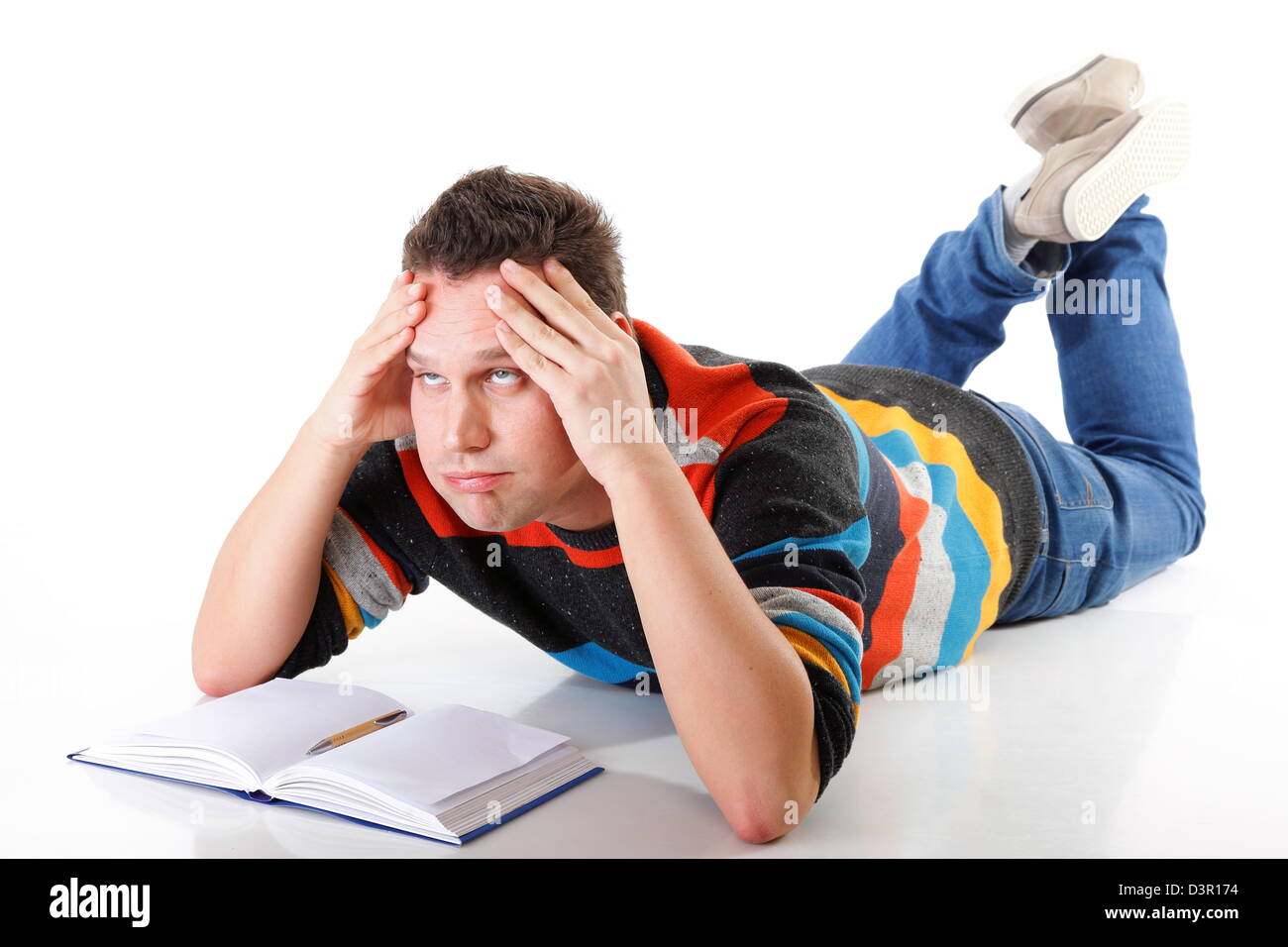 tired college student with book after hard work for exam on white ...