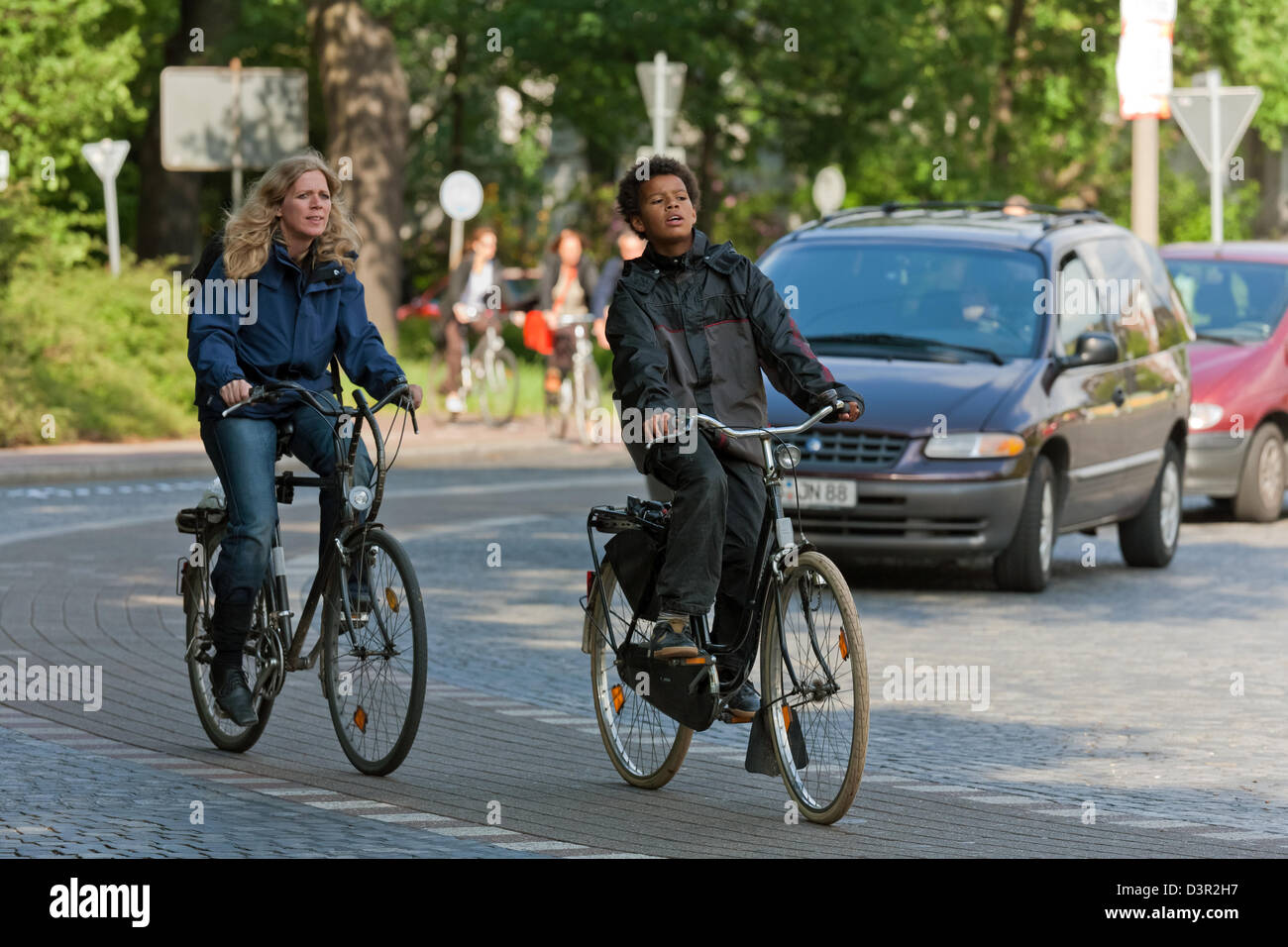Woman driving bike street germany hi-res stock photography and images ...