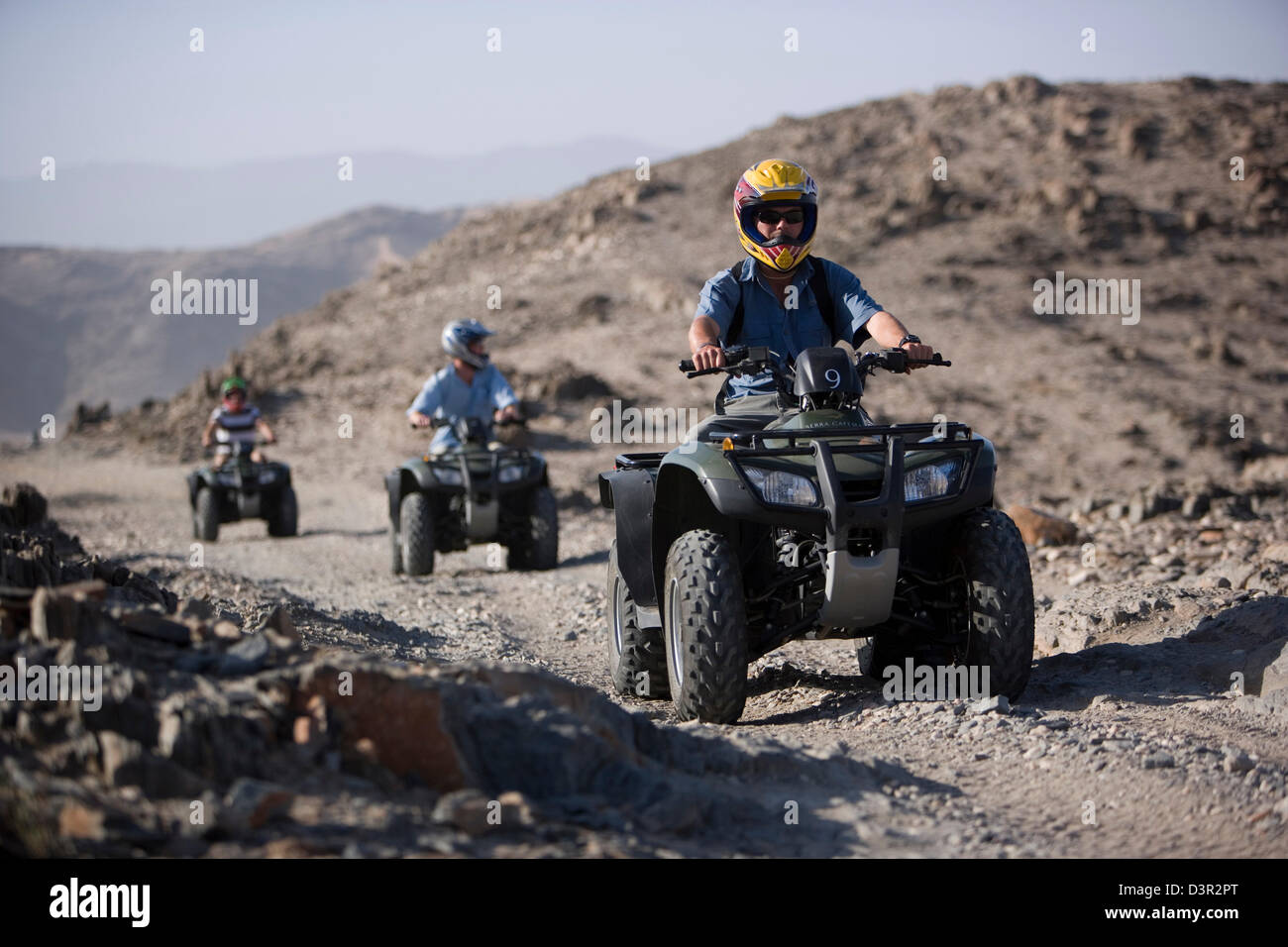 Quad biking in desert of Serra Caferna, Kaokoland, Namibia Stock Photo ...