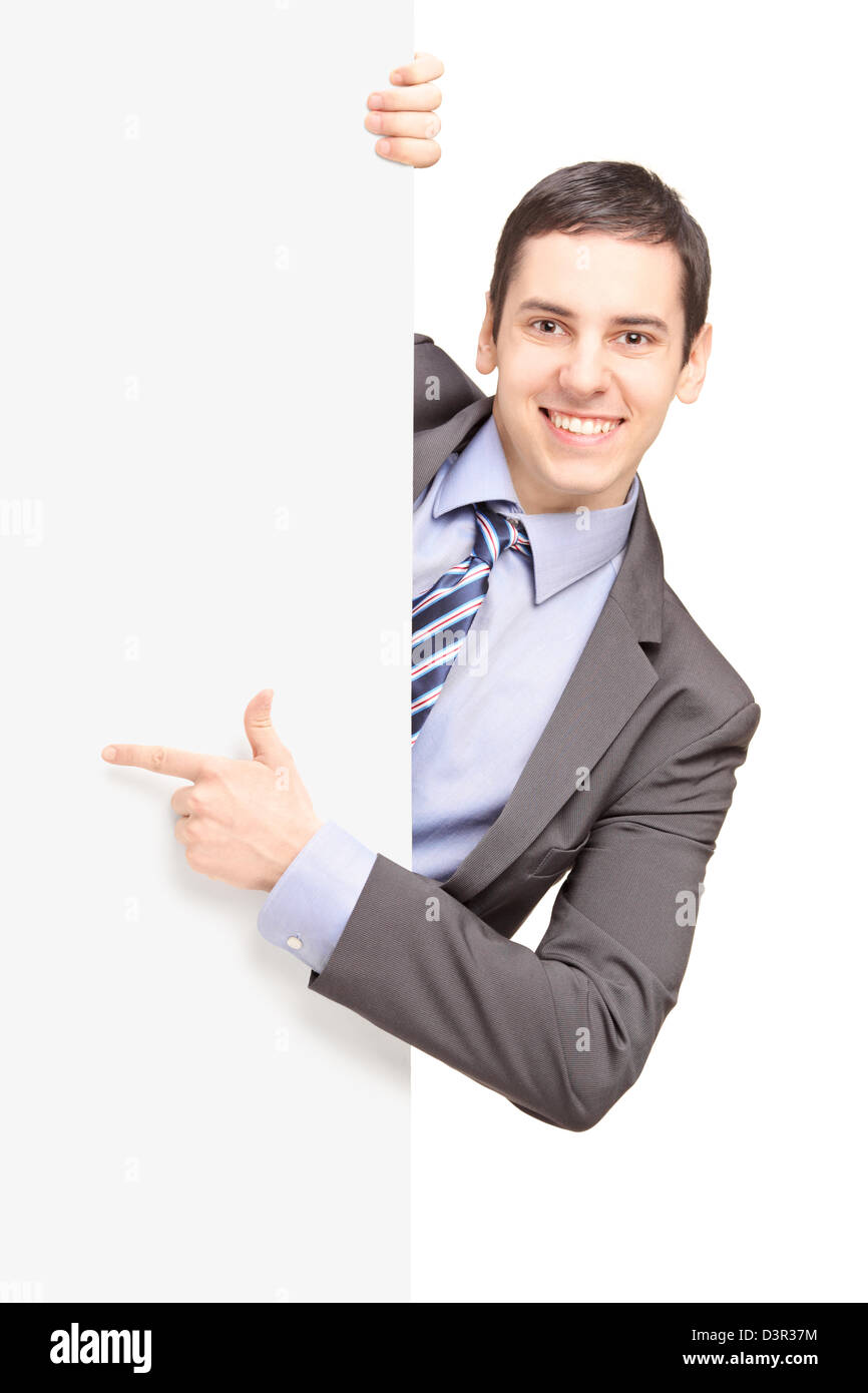 Young man behind whiteboard pointing hi-res stock photography and ...