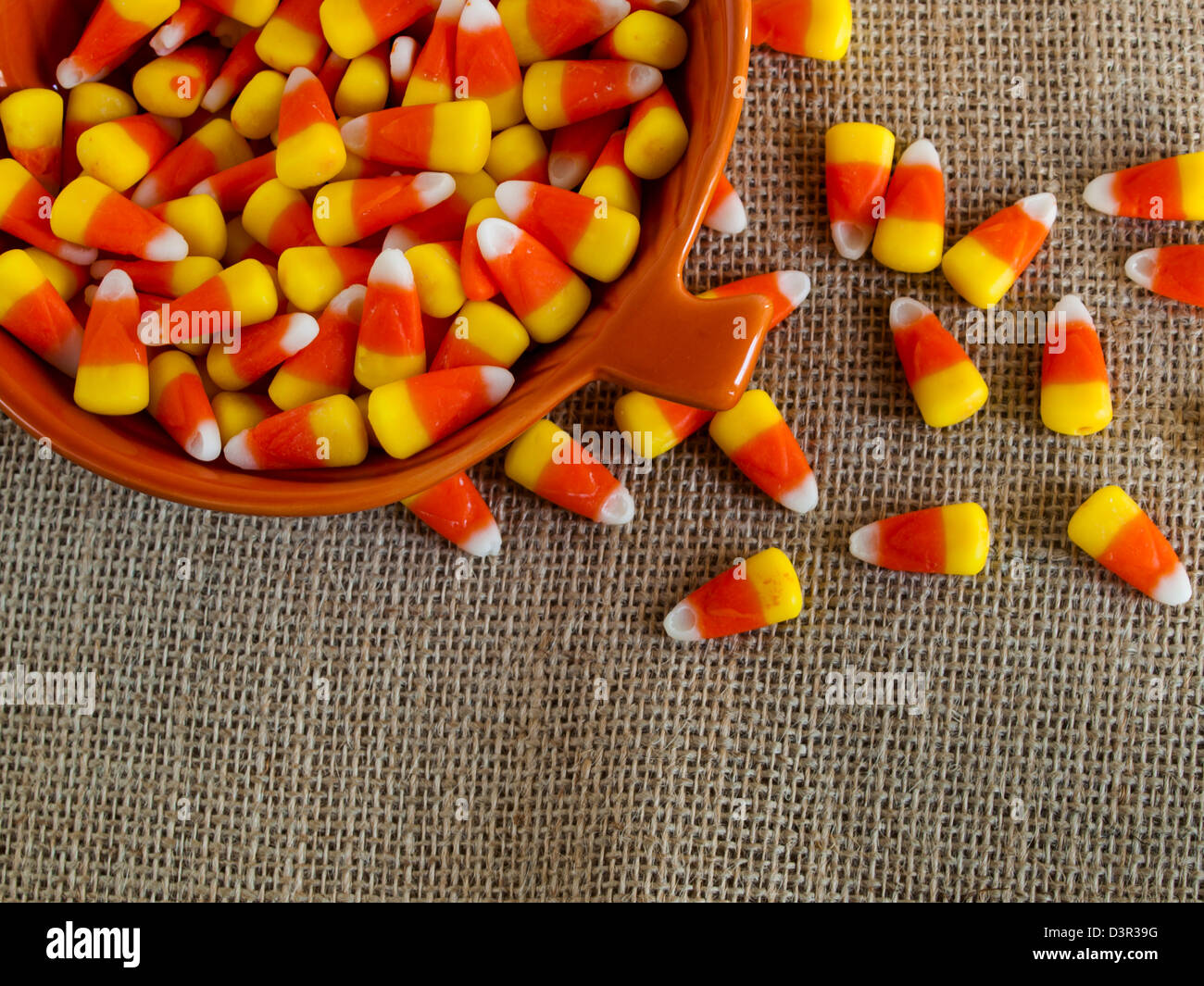 Traditional Halloween candies candy corn in orange bowl Stock Photo - Alamy