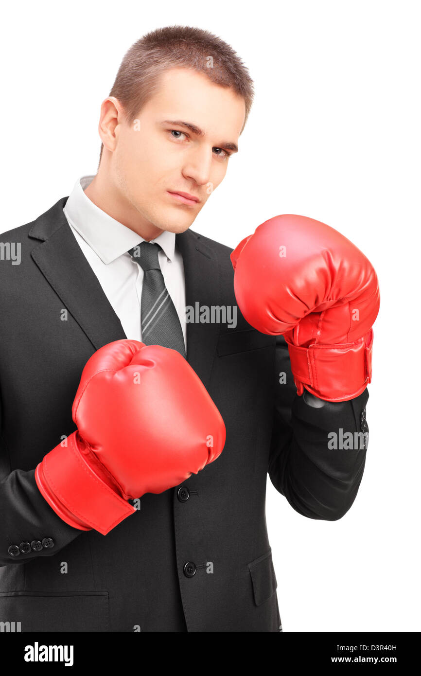 Young man in suit with red boxing gloves ready to fight isolated on ...