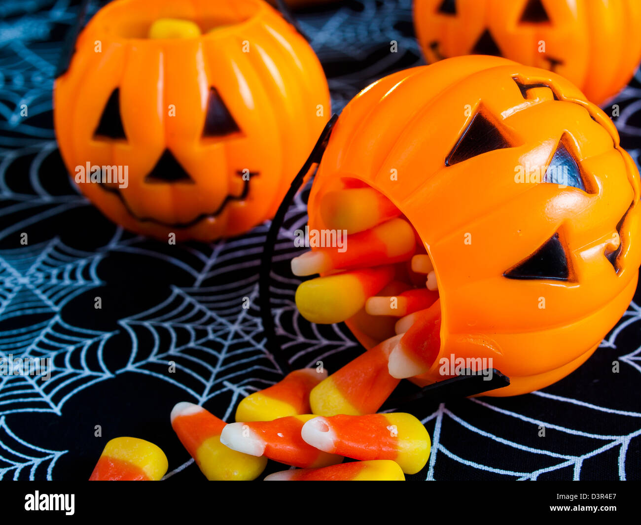 Candy corn candies falling out of Halloween treat bag Stock Photo - Alamy