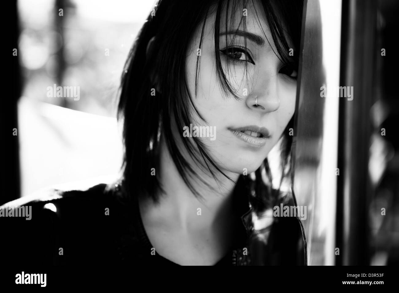 Young beautiful woman staring at camera Stock Photo - Alamy