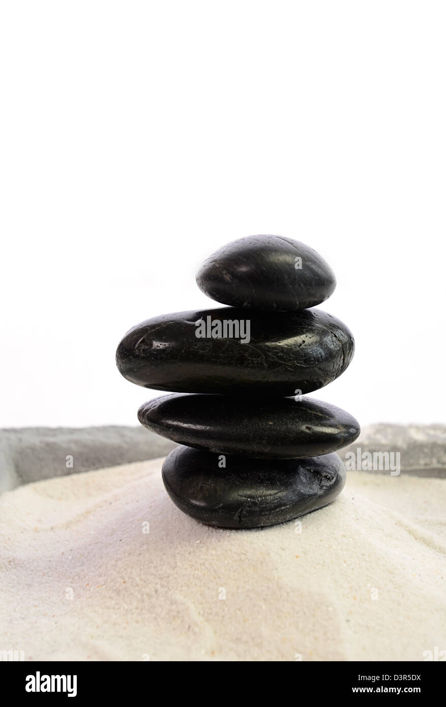 Pile of hot stones on sand Stock Photo - Alamy