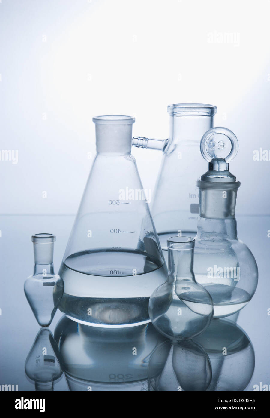 Laboratory glassware over white background Stock Photo - Alamy
