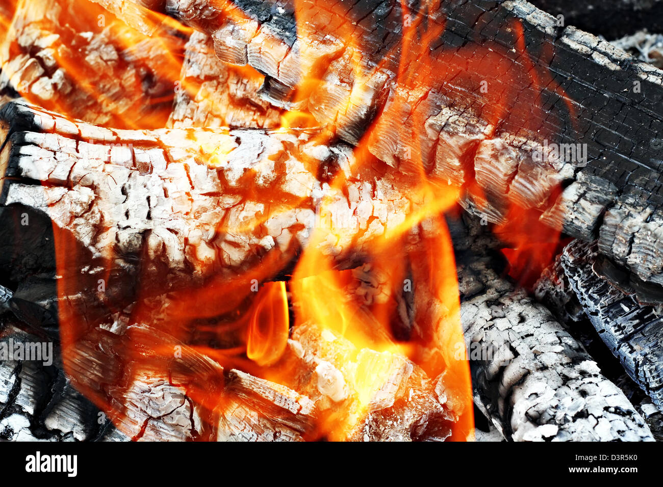Very hot camp fire as a background Stock Photo - Alamy