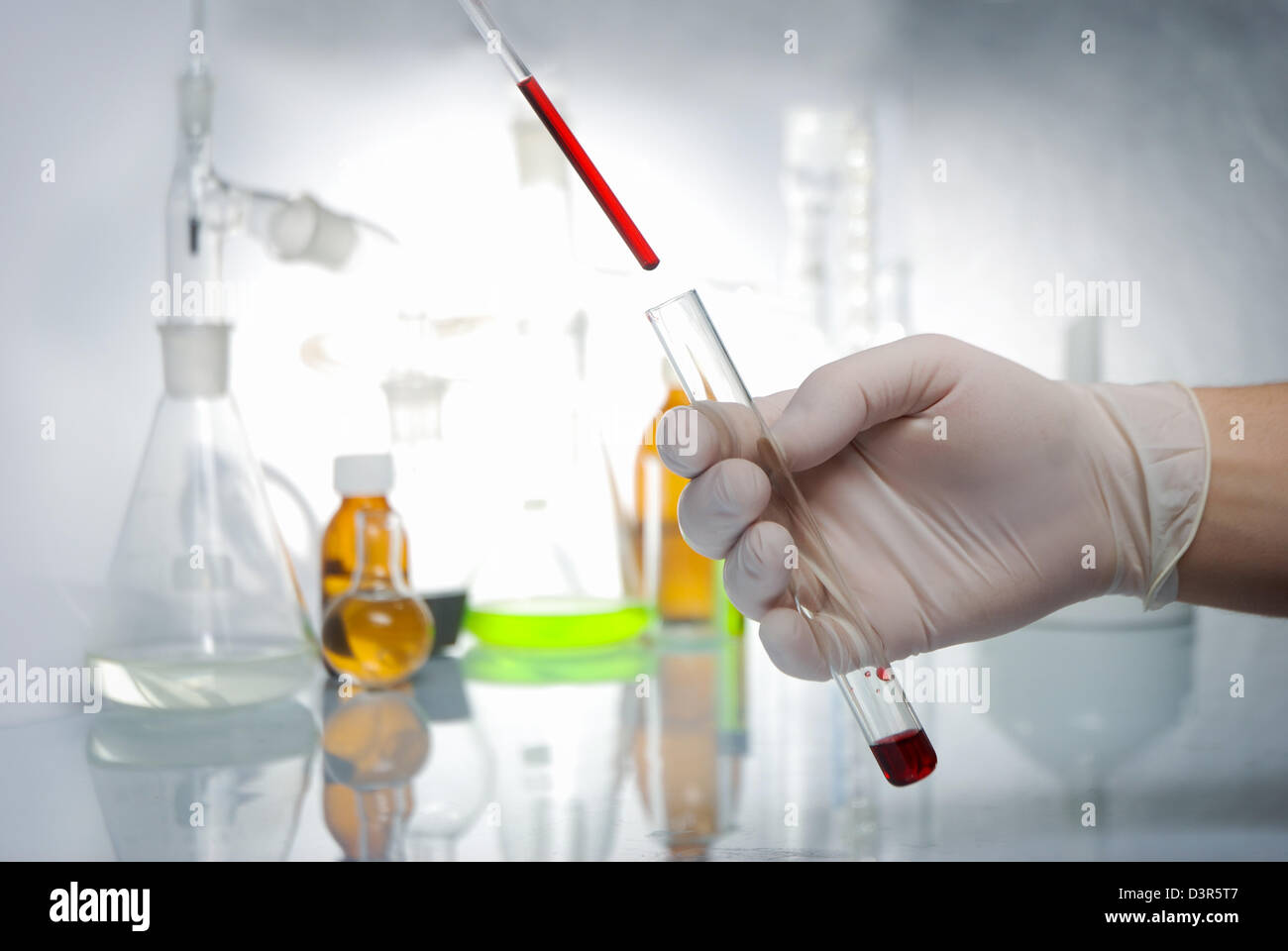 Doctor's hand in glove with blood in laboratory Stock Photo - Alamy