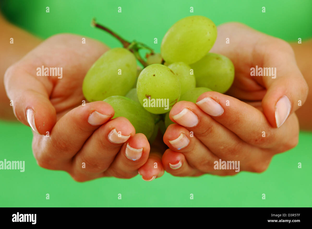 grape in woman hands close up Stock Photo - Alamy