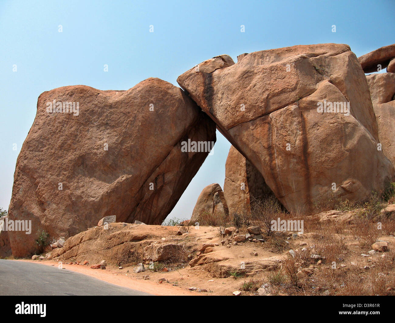 Stone against stone on the red ground Stock Photo - Alamy