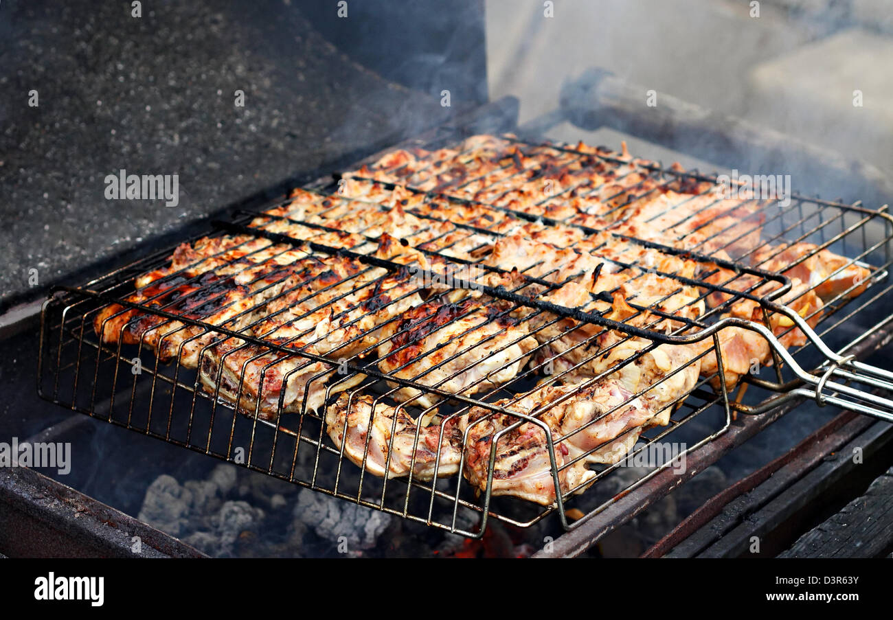 Meat cooking in the barbecue, high resolution Stock Photo - Alamy