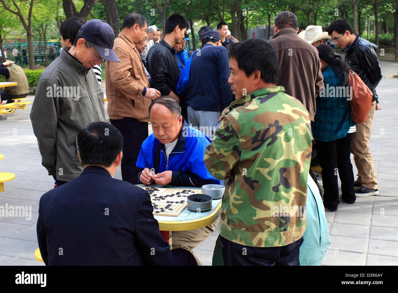 View of Chinese people playing games in Lianhuachi Park, Beijing City ...