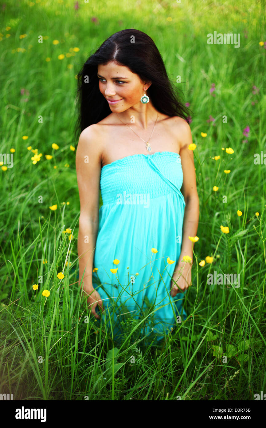 beautiful woman on flower field Stock Photo - Alamy