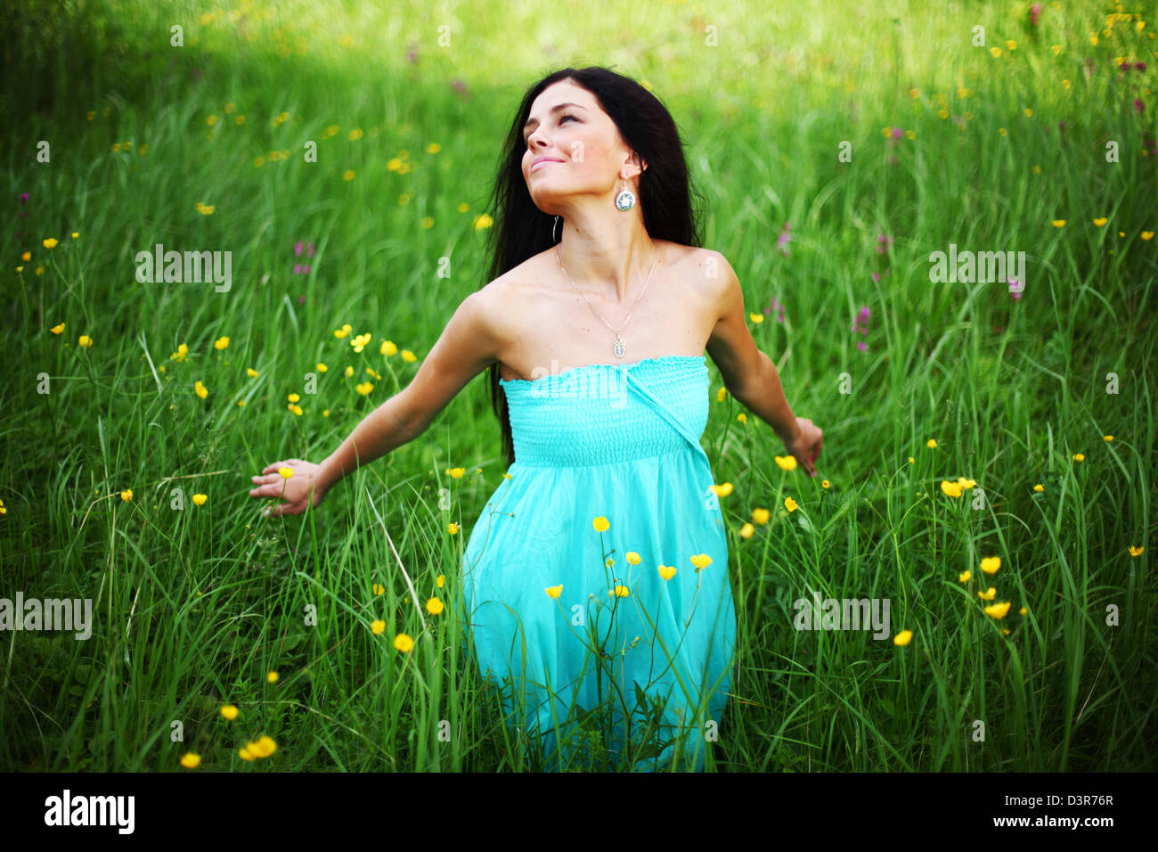 beautiful woman on flower field Stock Photo - Alamy
