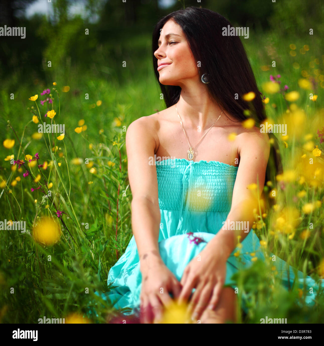 beautiful woman on flower field Stock Photo - Alamy