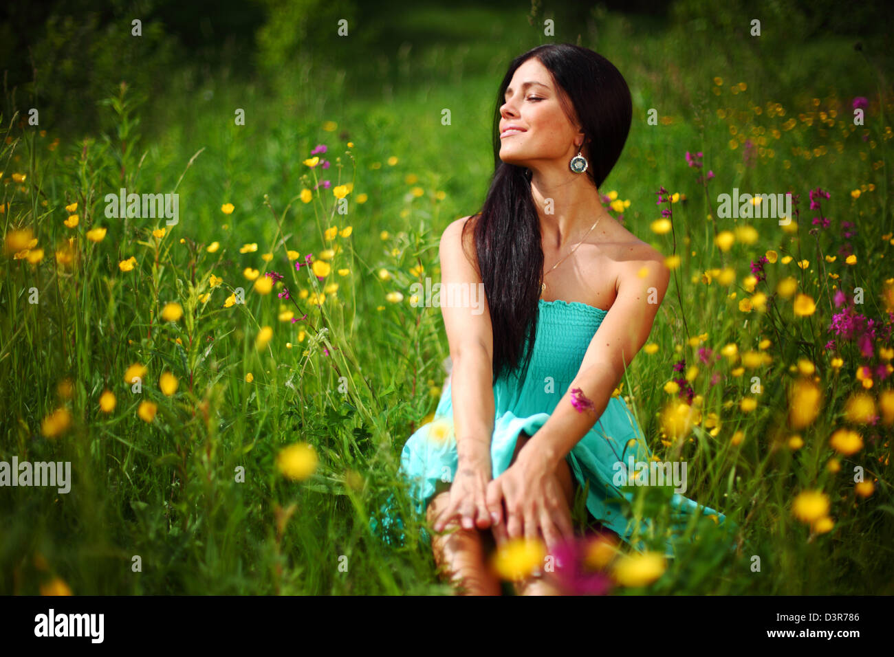 beautiful woman on flower field Stock Photo - Alamy