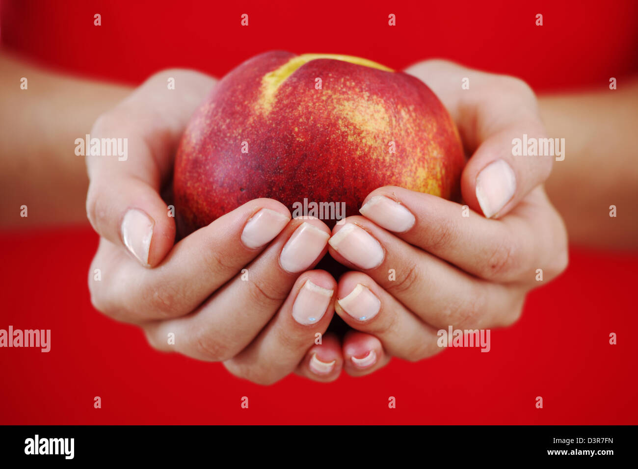 Hand holding peach hi-res stock photography and images - Alamy