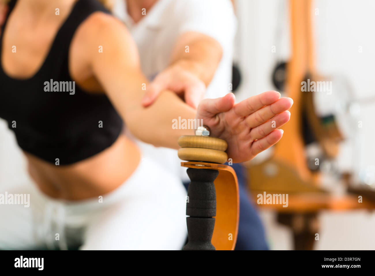 Patient at the physiotherapy making physical exercises Stock Photo - Alamy