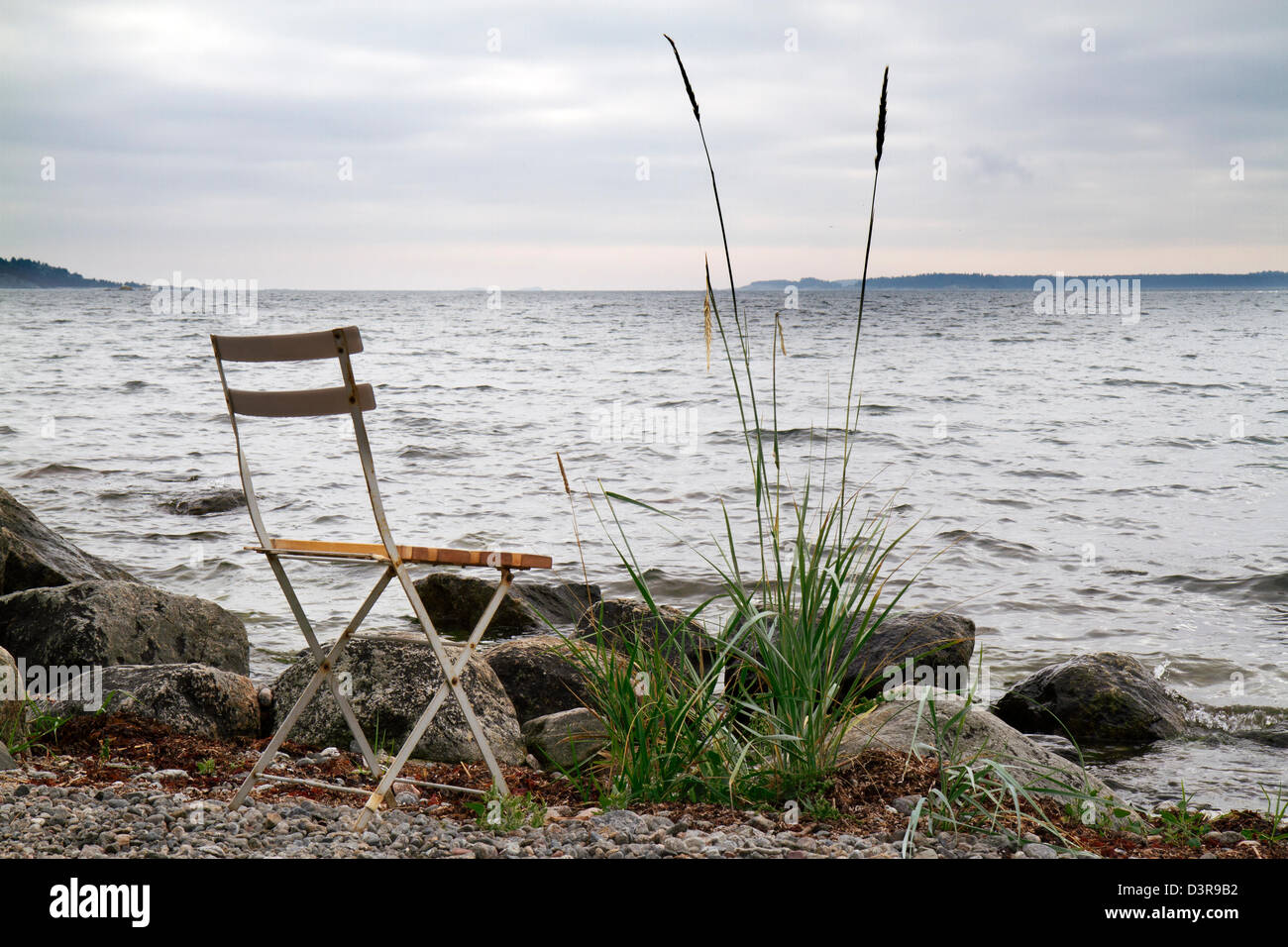 Lonely chair on beach Stock Photo - Alamy