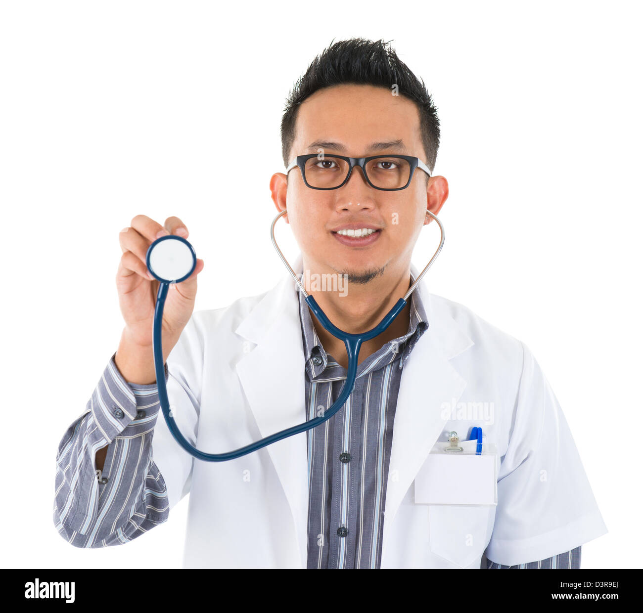 Southeast Asian medical doctor with stethoscope in hand, standing on ...