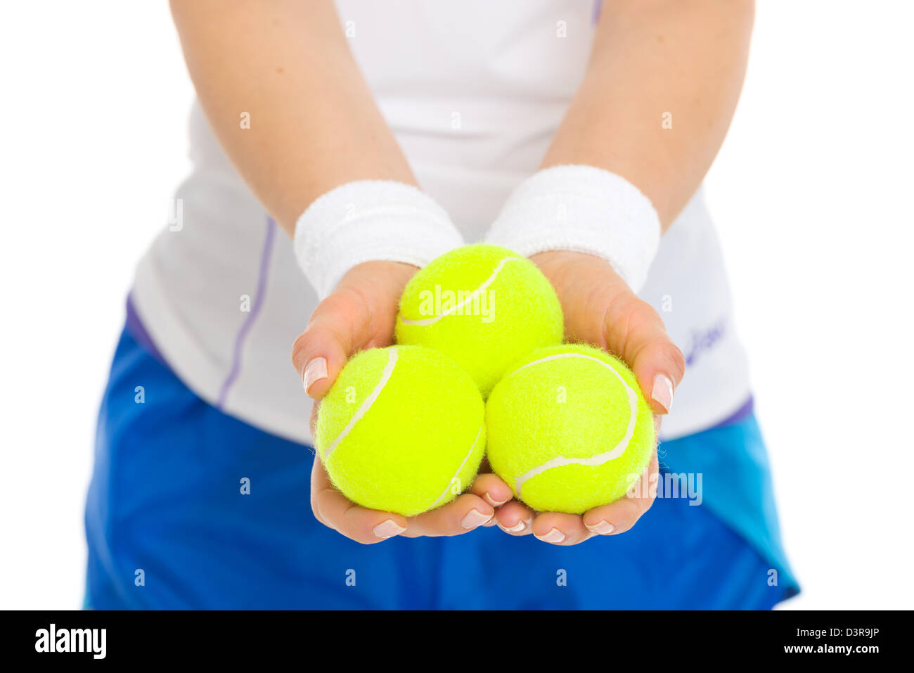 Closeup on 3 tennis balls in hand of tennis player Stock Photo - Alamy