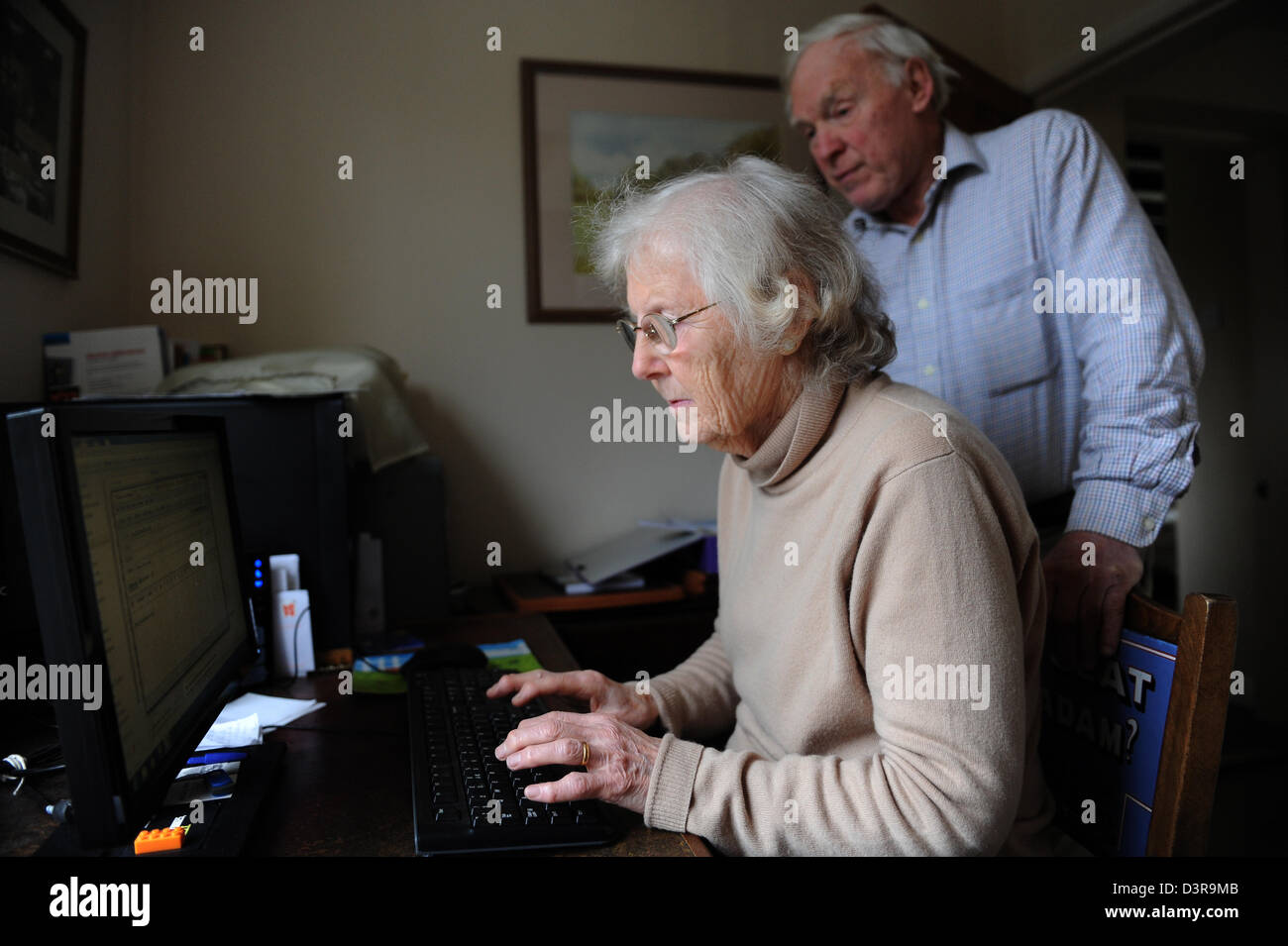 Helping to use a computer hi-res stock photography and images - Alamy