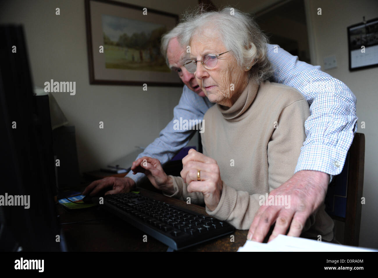 Helping to use a computer hi-res stock photography and images - Alamy