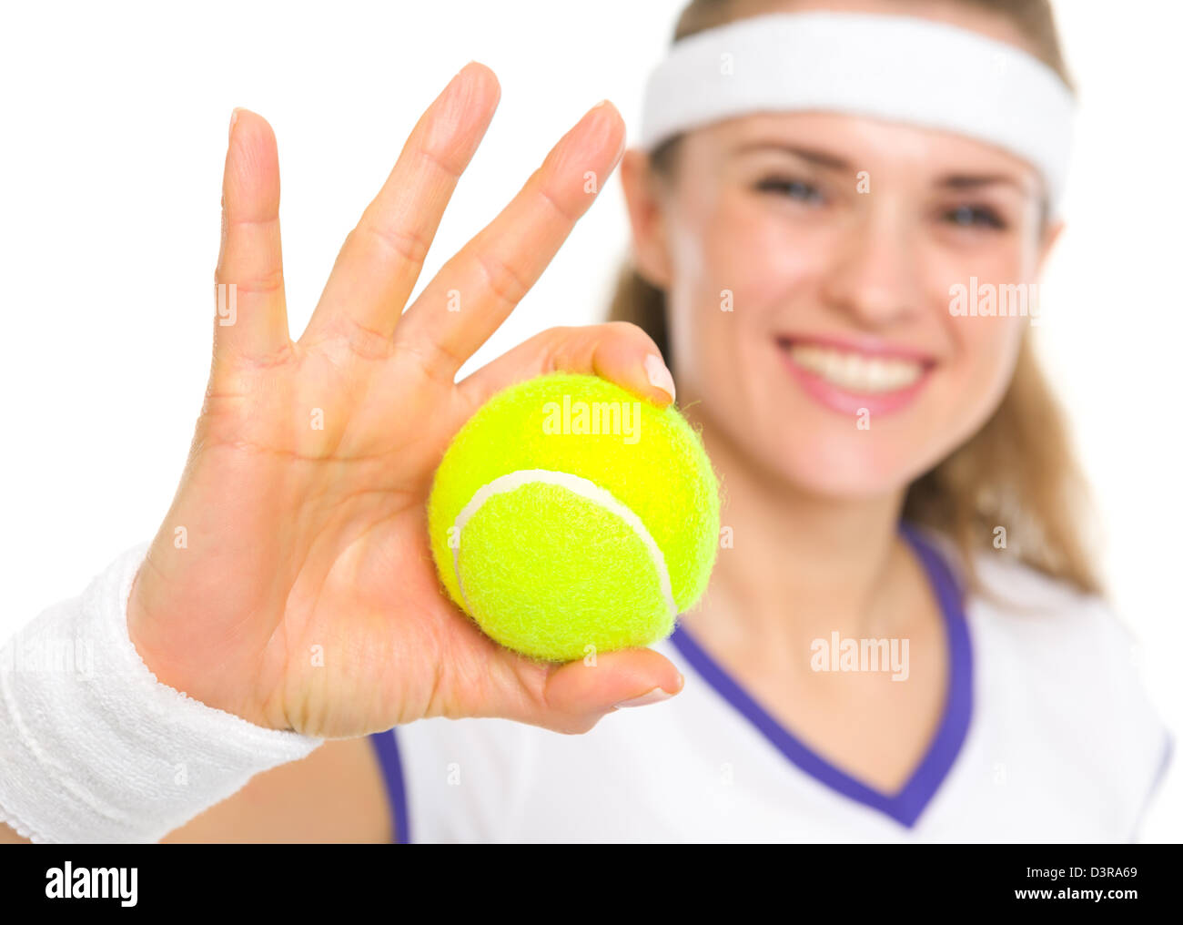 Closeup on ball in hand of smiling tennis player Stock Photo - Alamy
