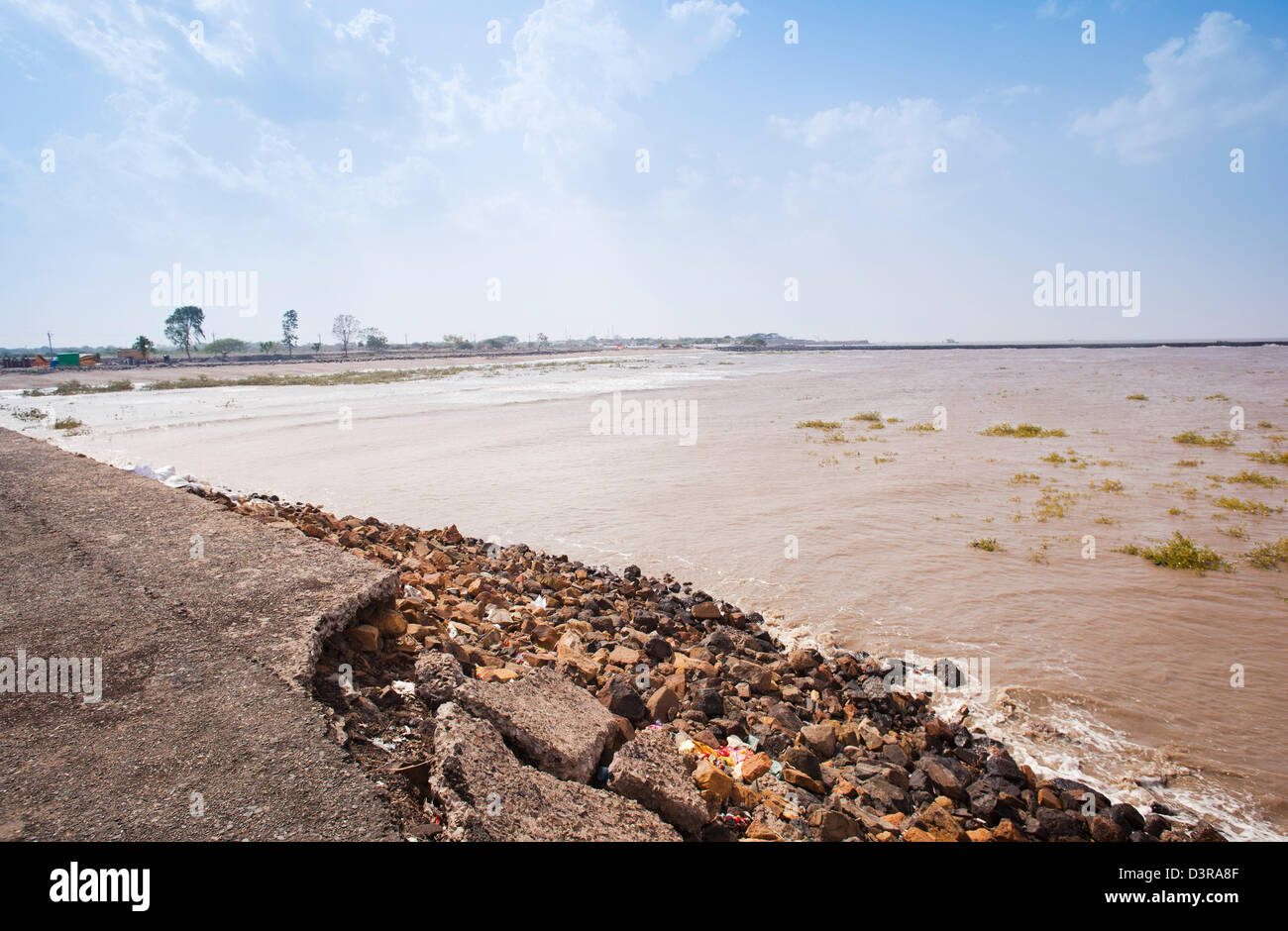 Rocks with muddy water at Ghogha Beach, Bhavnagar, Gujarat, India Stock ...