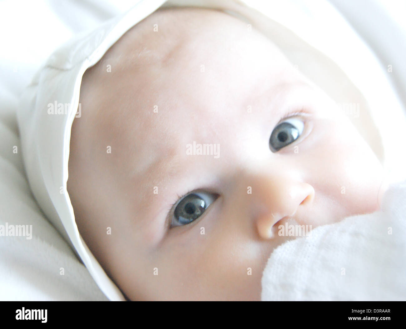 Cute baby face with white hat Stock Photo - Alamy