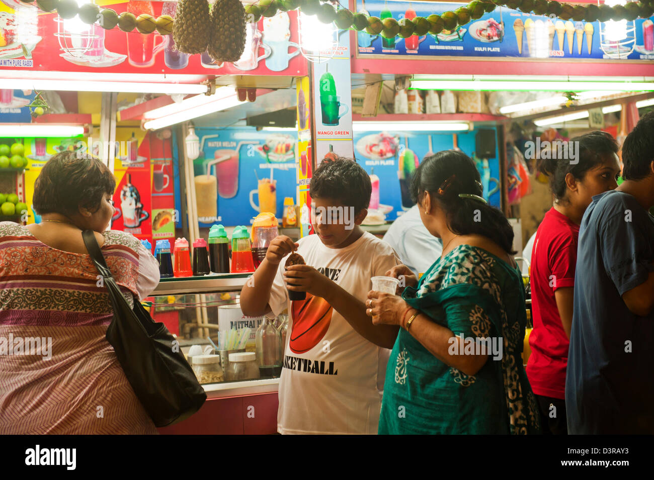 People eating ice cream at a ice cream parlor, Juhu Beach, Mumbai ...
