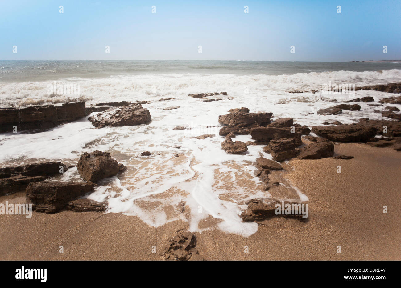 Surf with rocks on the beach, Dwarka Beach, Dwarka, Gujarat, India ...