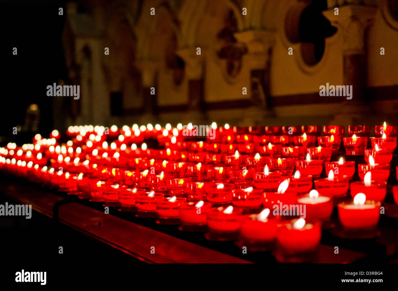 Prayer candles alight in the Prayer candles alight in the Basilica of ...