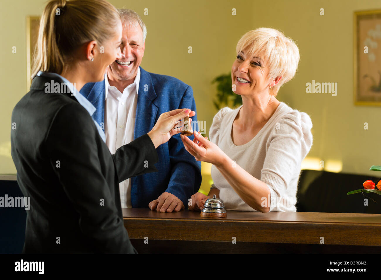 Reception - Guests check in at hotel and getting the key Stock Photo ...