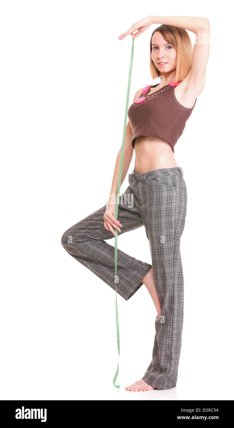 Beautiful young caucasian woman measuring her body with tape, isolated ...