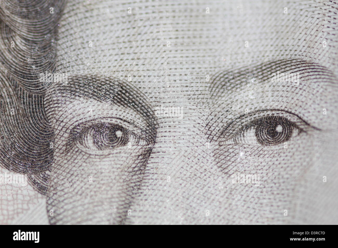 A macro image of Queen Elizabeth II's eyes from of a UK Sterling £10 ...