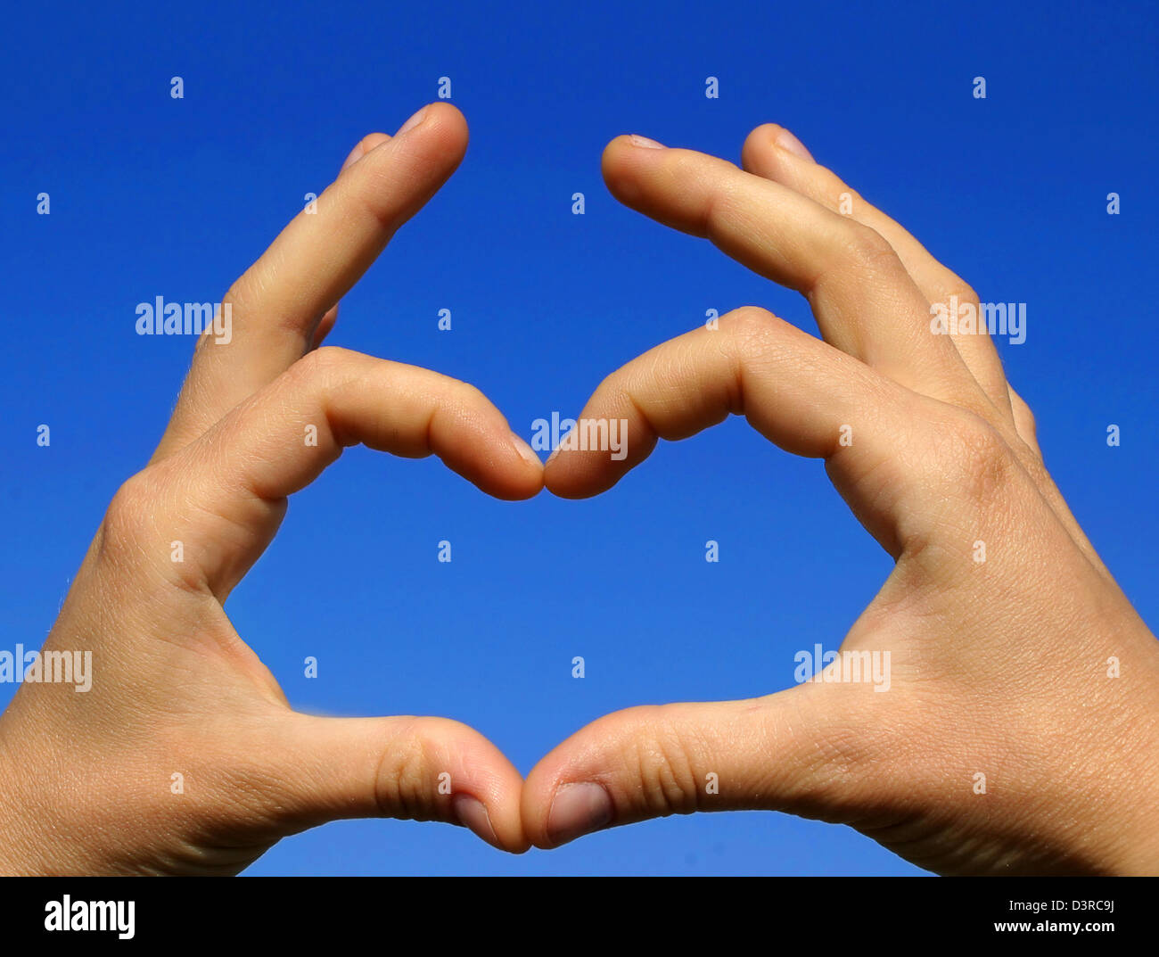 Sign of love making by woman hand Stock Photo - Alamy