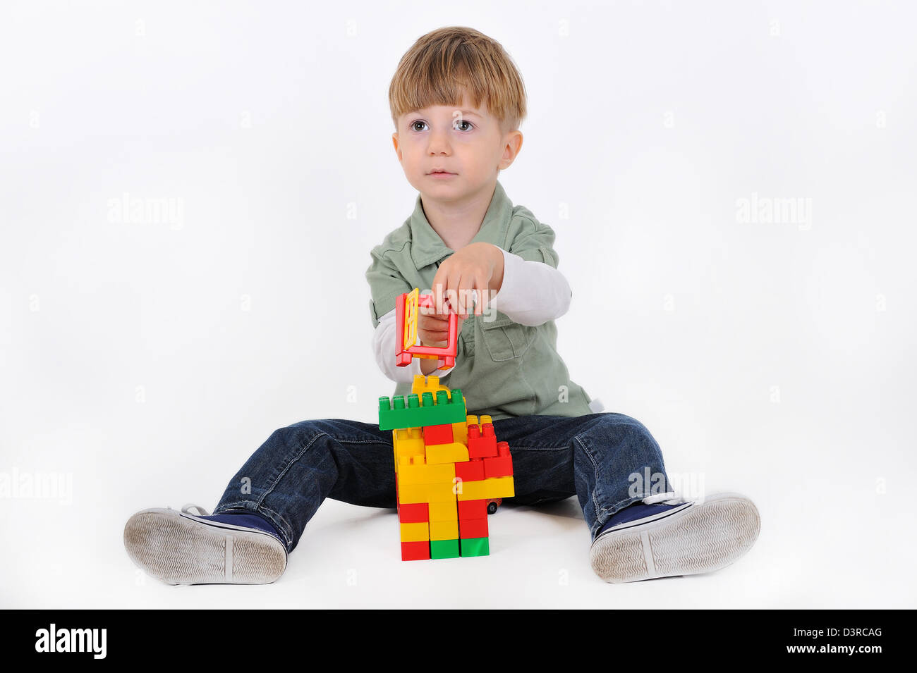 kid playing with constructor Stock Photo - Alamy