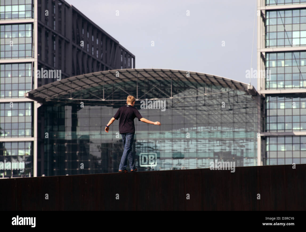 Berlin, Germany, a young man balancing on an art installation Stock ...