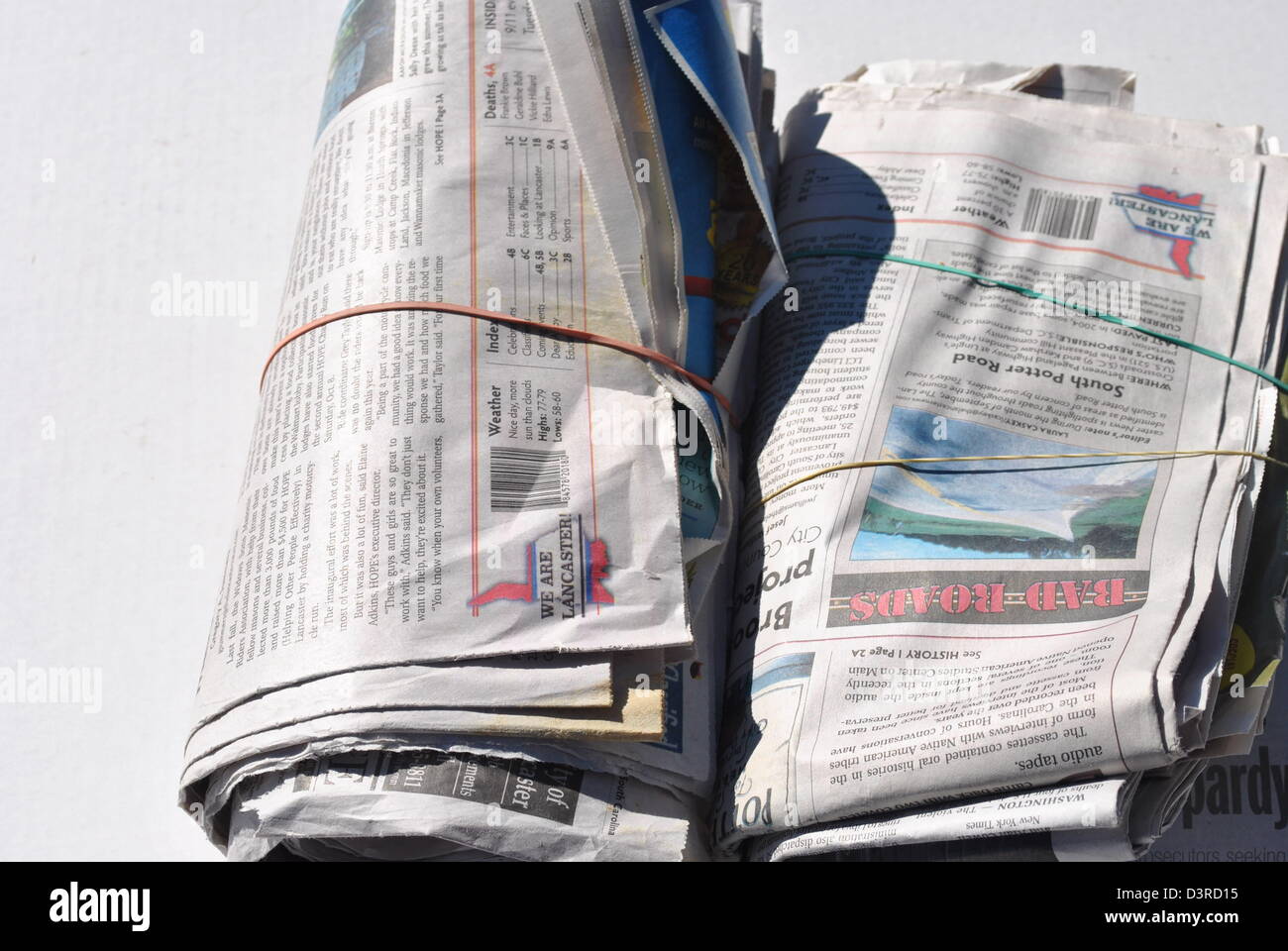 a couple bundles of newspapers Stock Photo - Alamy
